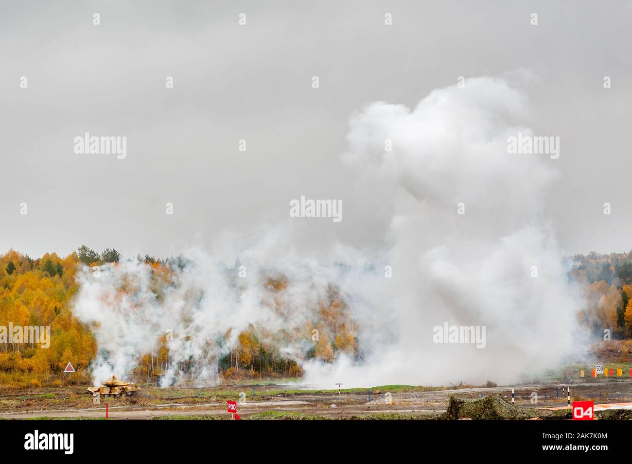 Russian tank T-90 hides in smoke screen from enemy Stock Photo - Alamy