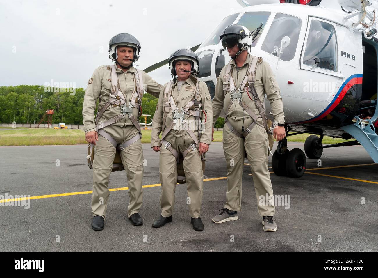 Pilots before flight in front of MI-8 helicopter Stock Photo - Alamy
