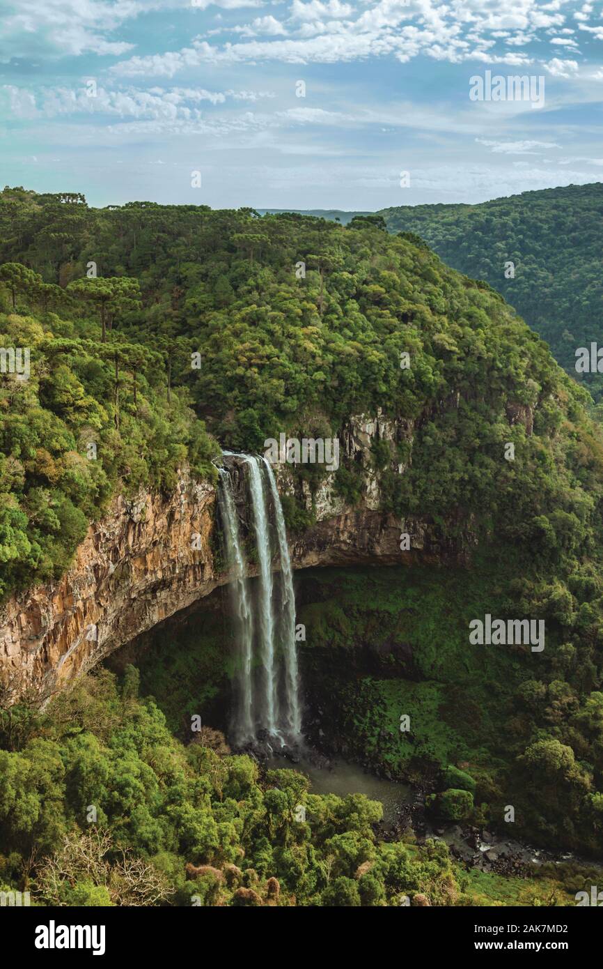 Caracol waterfall falling from rocky cliff in a forest from a park near ...