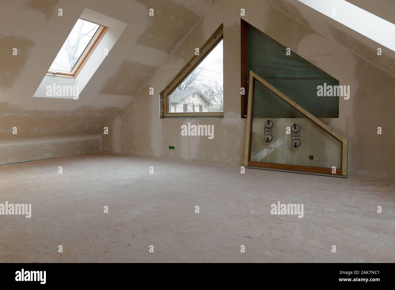 PVC window instalation in a new insulated and filled dry wall attic ...