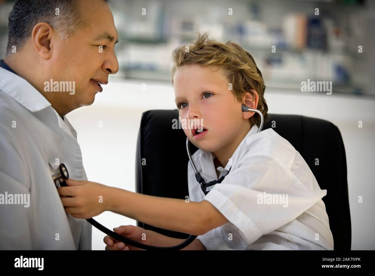 Doctor caring for small boy hi-res stock photography and images - Alamy
