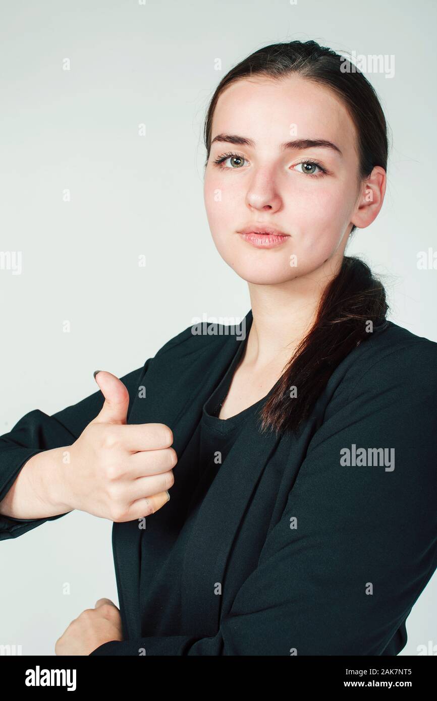 young pretty girl pointing and gesturing on white background, business ...