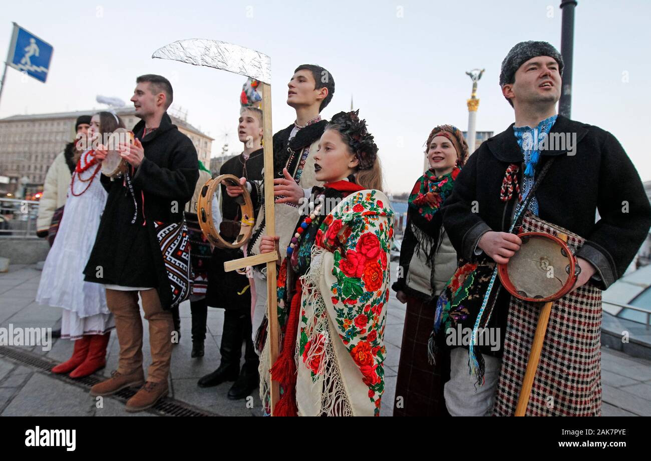 People wearing traditional clothes sing Christmas carols during the ...