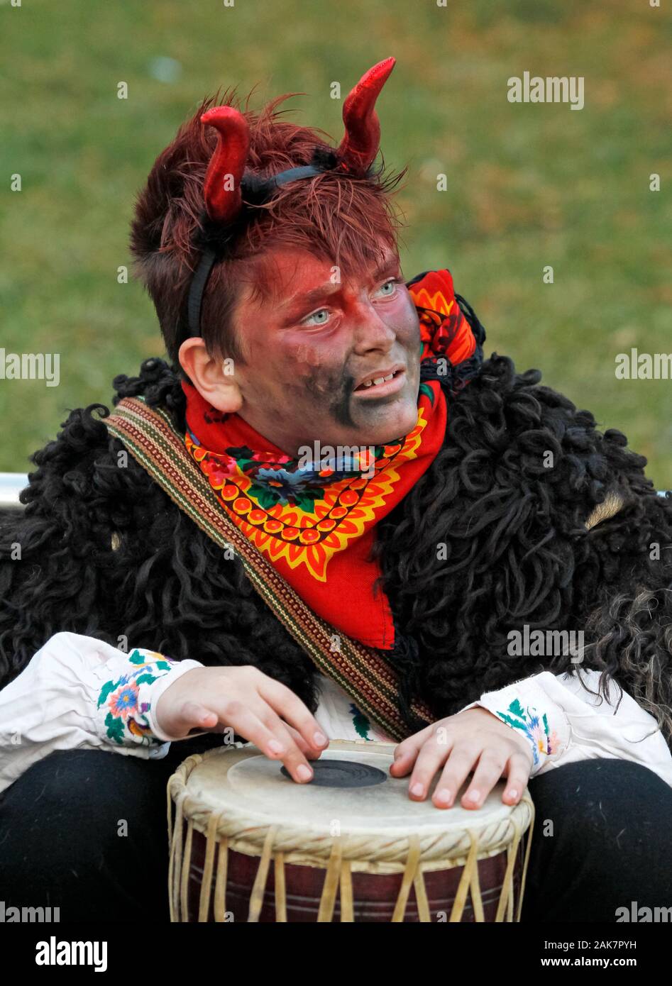 A man wearing a traditional outfit attends the Orthodox Christmas ...