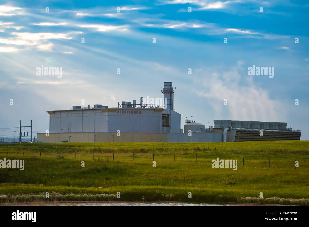 A large industrial complex is seen surrounded by rural countryside ...
