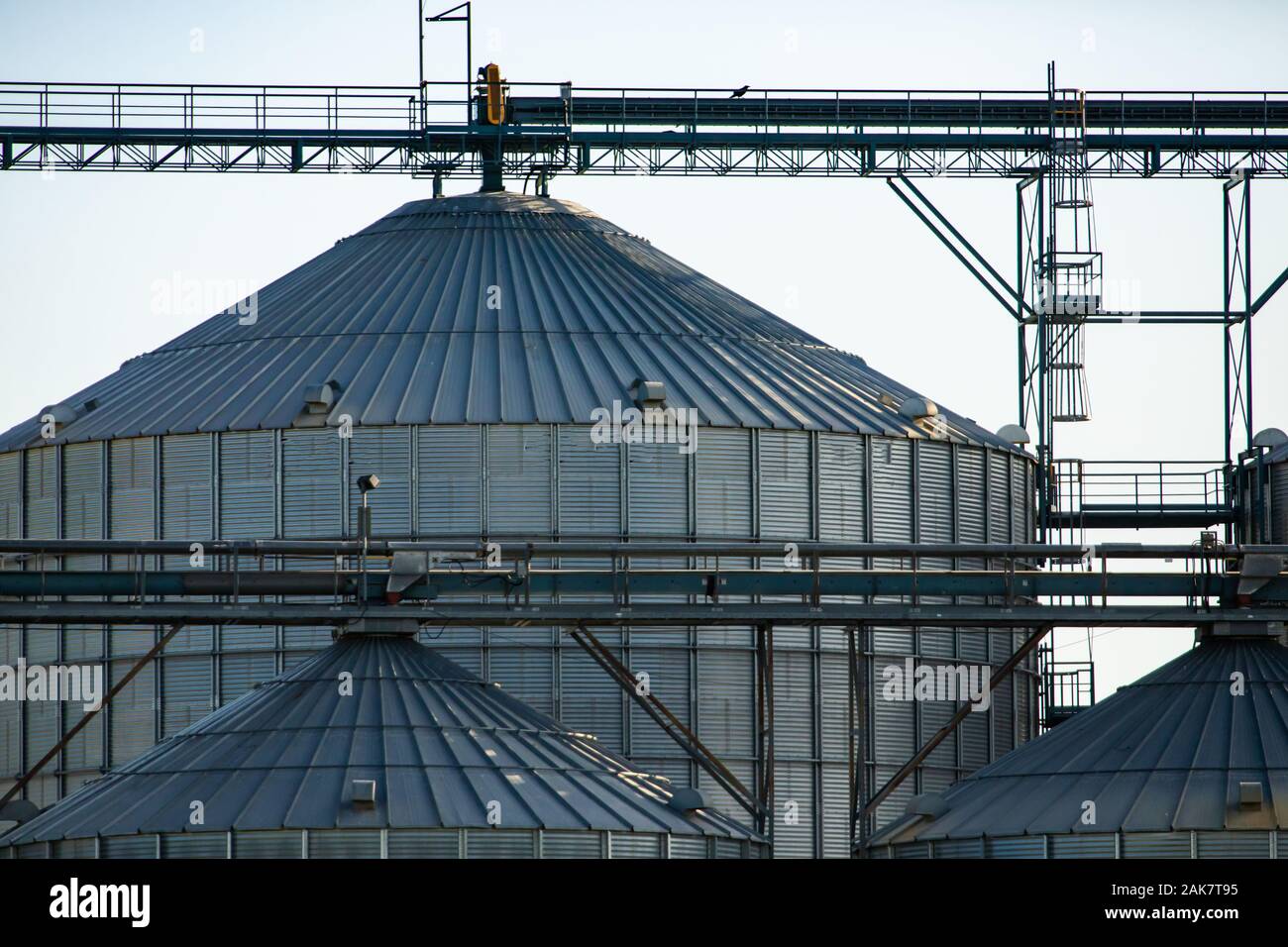 Closeup view of a large scale agrarian facility, large steel silos are ...