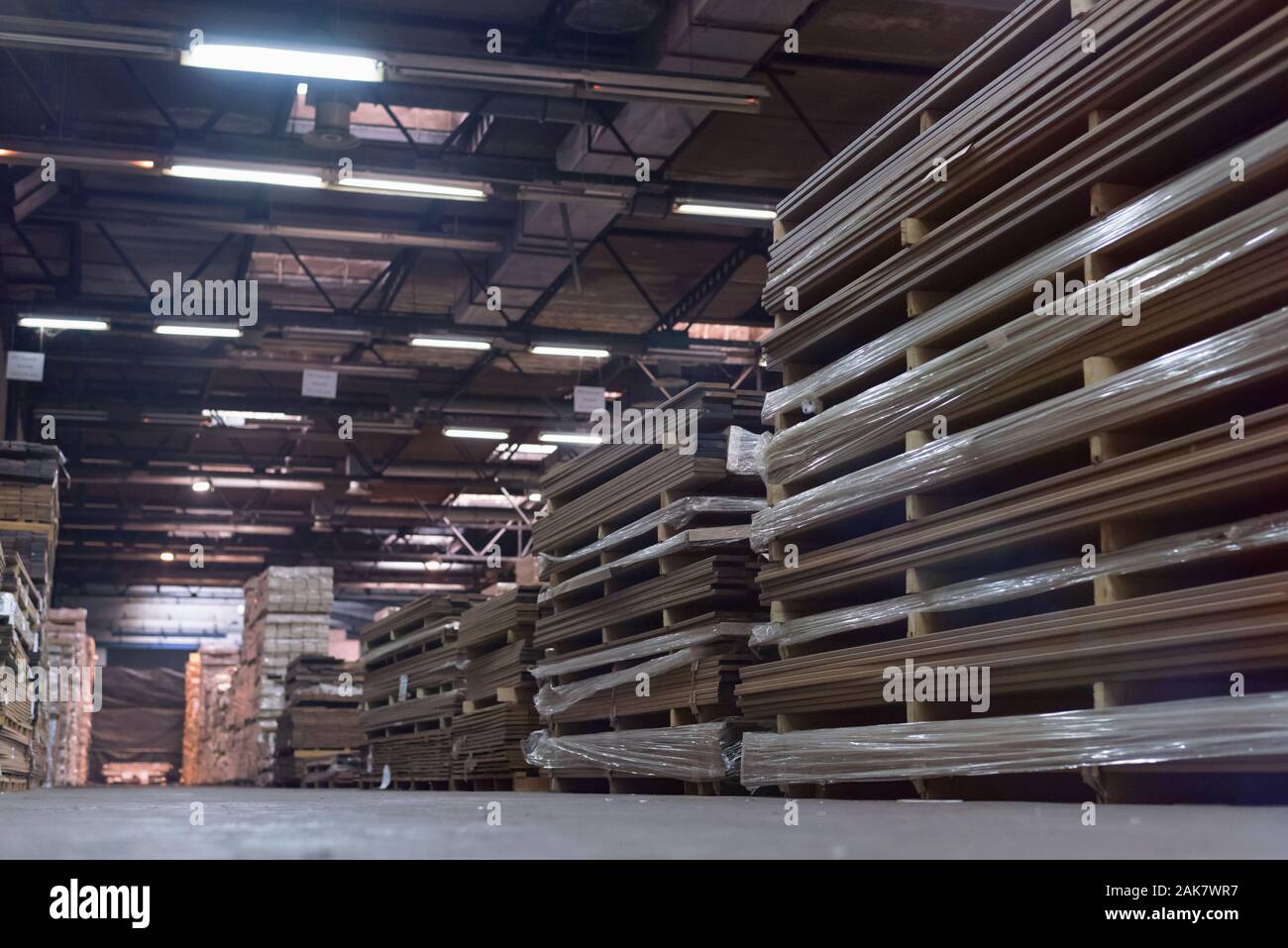 Timber Flooring Factory. Pile of cut wood in factory storage warehouse ...