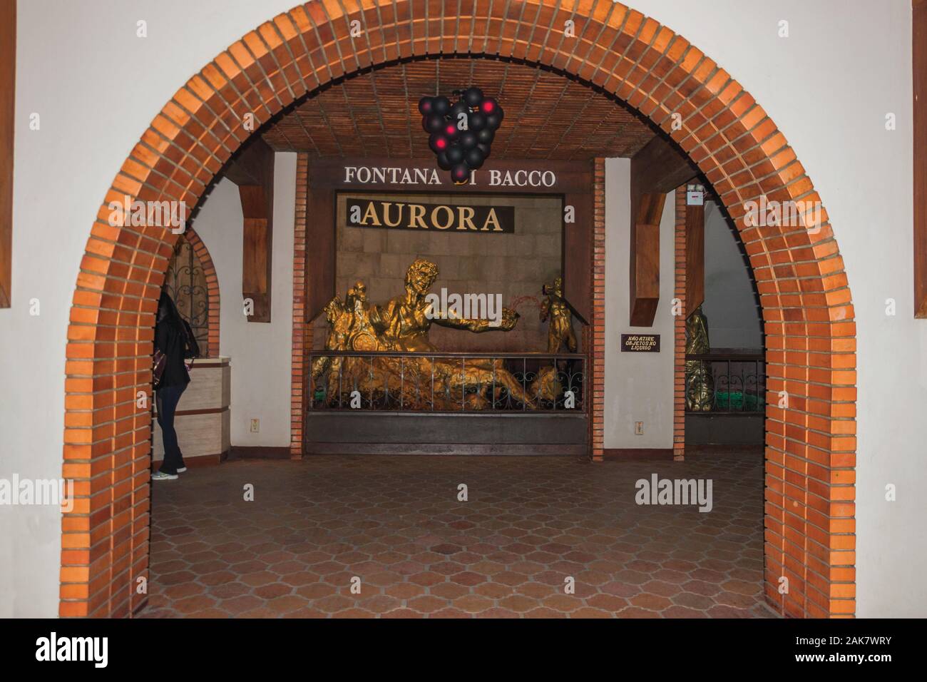 Wine fountain with sculpture and company signboard at the Aurora Winery ...