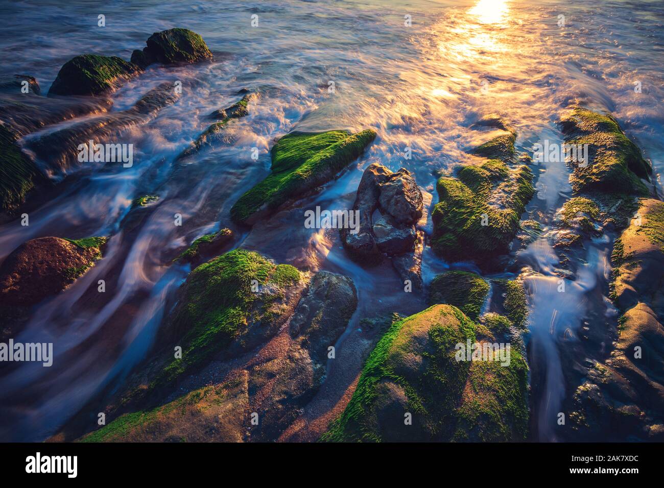 Long exposure of sea and rocks Stock Photo - Alamy