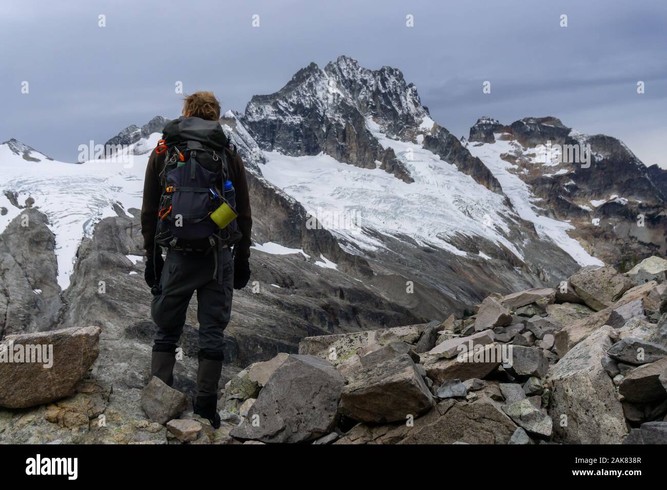 Adventurous man is hiking in the Beautiful Canadian Mountain Landscape ...