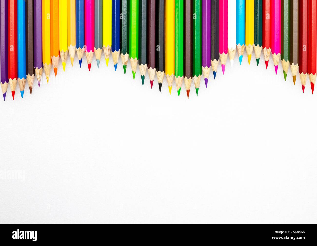 Colour pencils on white background close up Stock Photo - Alamy