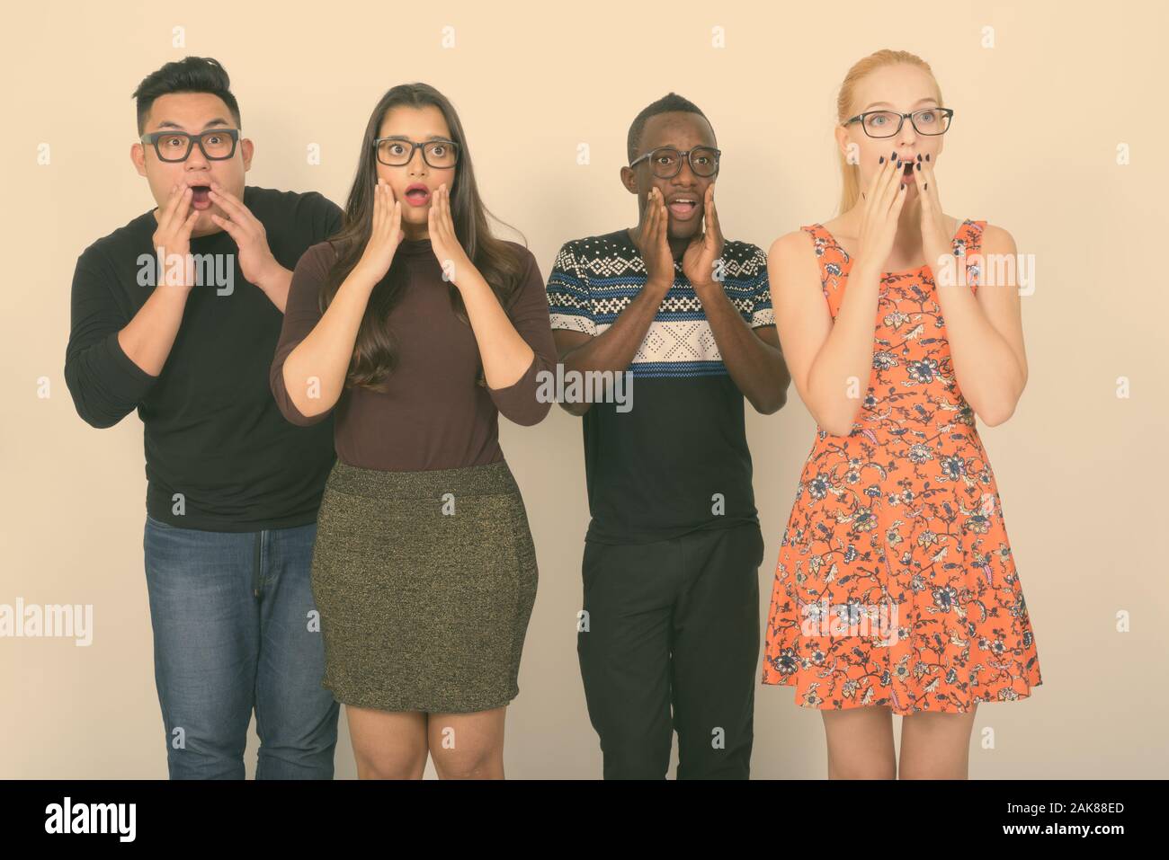 Studio shot of diverse group of multi ethnic friends thinking while ...