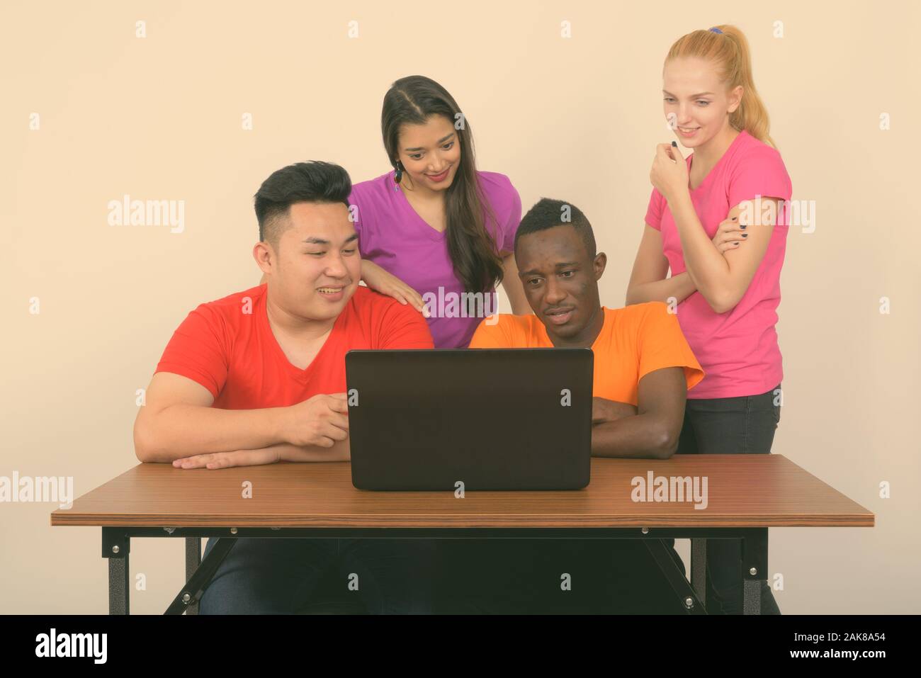 Studio shot of happy diverse group of multi ethnic friends smiling and ...