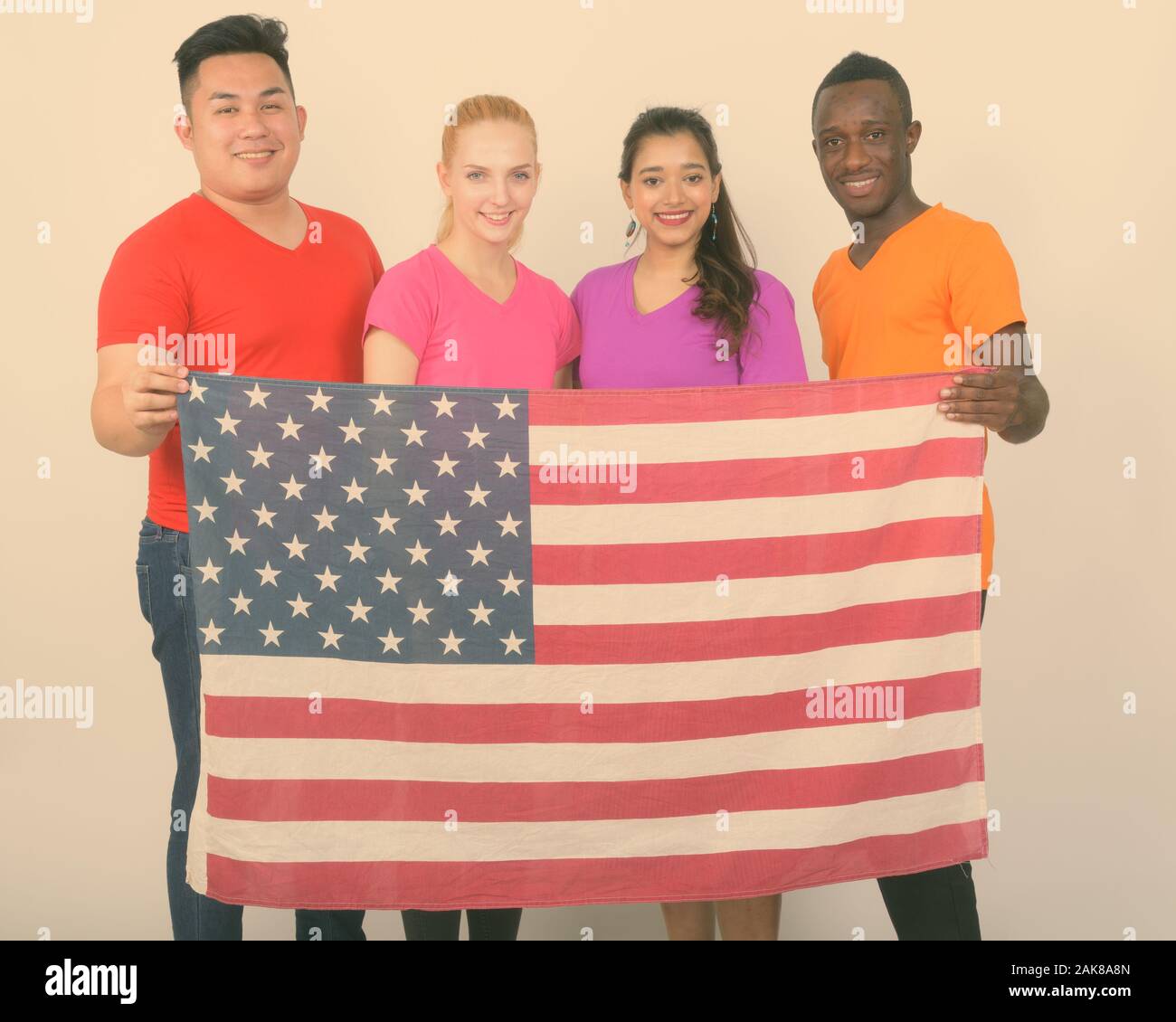 Studio shot of happy diverse group of multi ethnic friends smiling ...