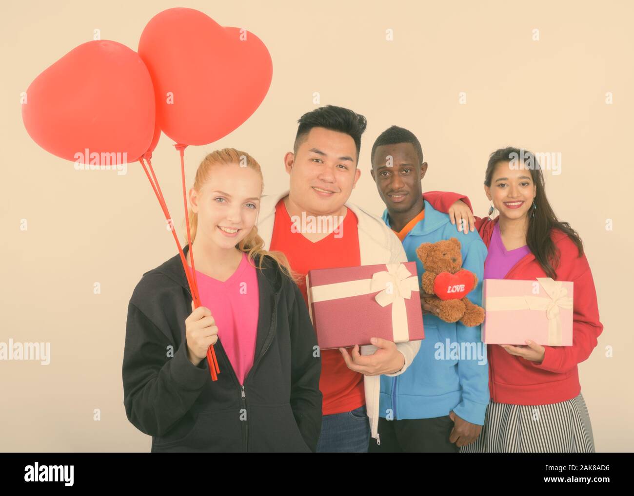Diverse multi ethnic group of happy friends ready for Valentine's day ...