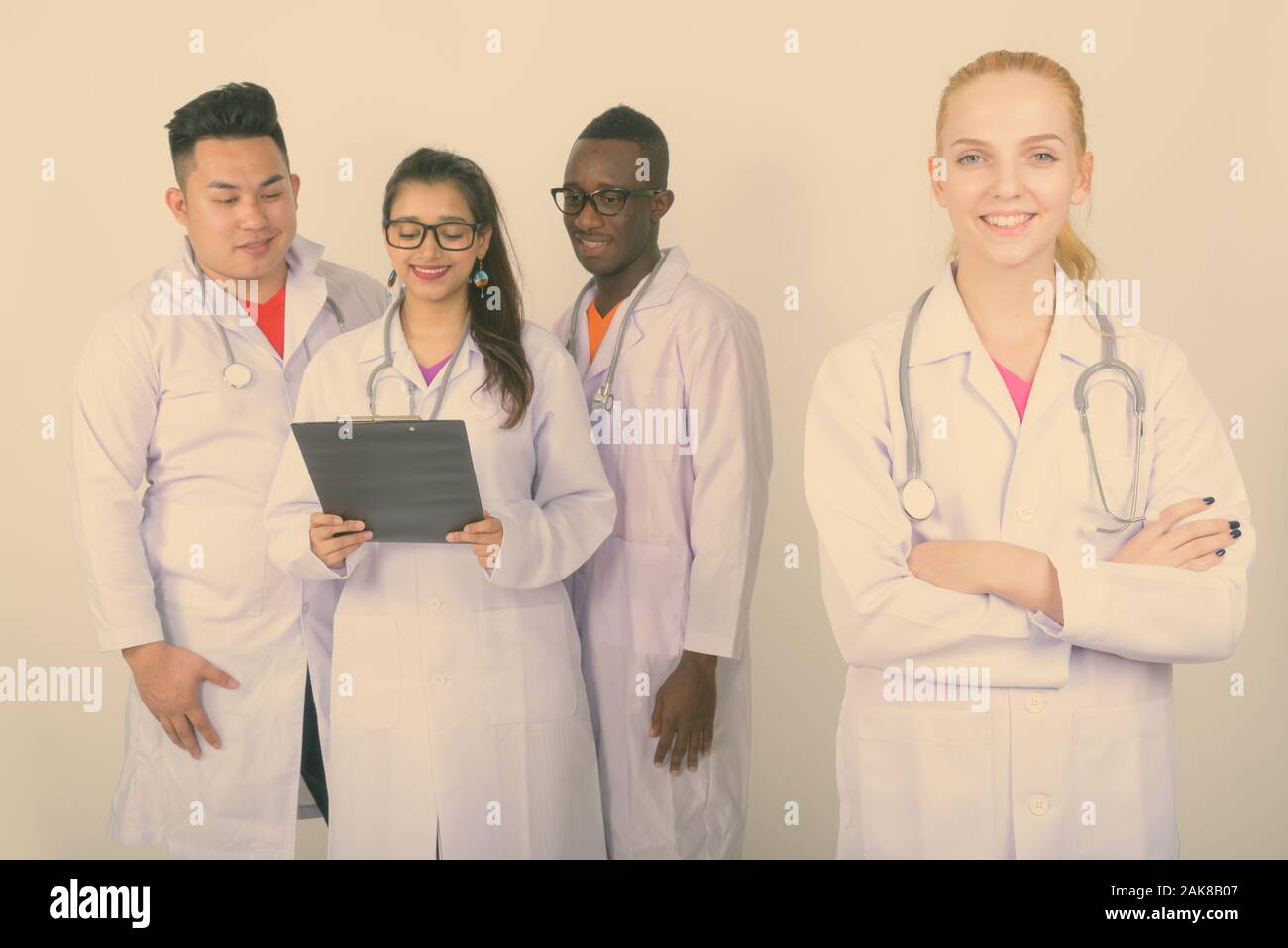 Diverse multi ethnic group of happy doctors working together Stock ...