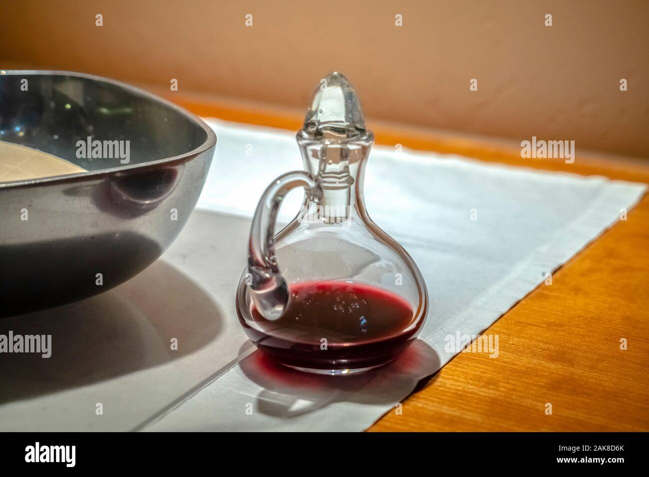 Glass carafe with red communion wine indoor Stock Photo - Alamy