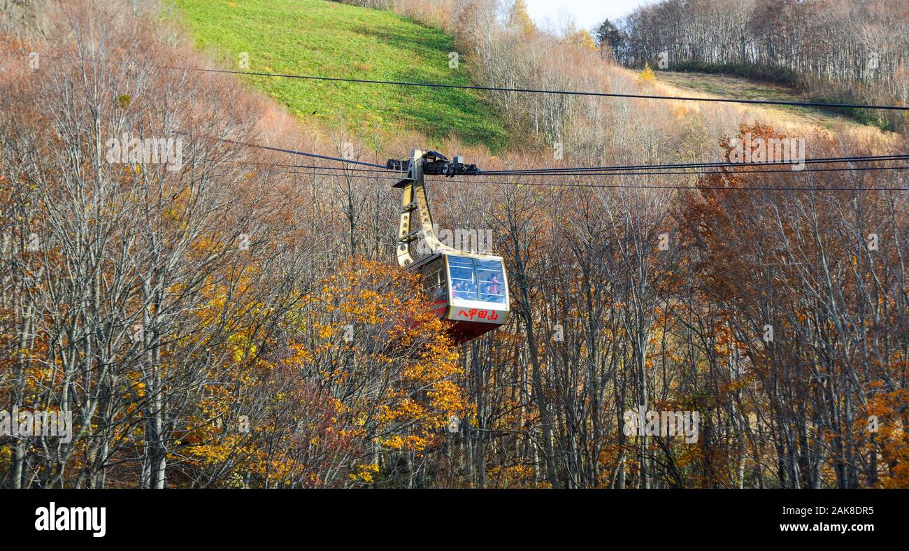 Aomori, Japan - Nov 4, 2019. Hakkoda Ropeway with autumn trees in sunny ...