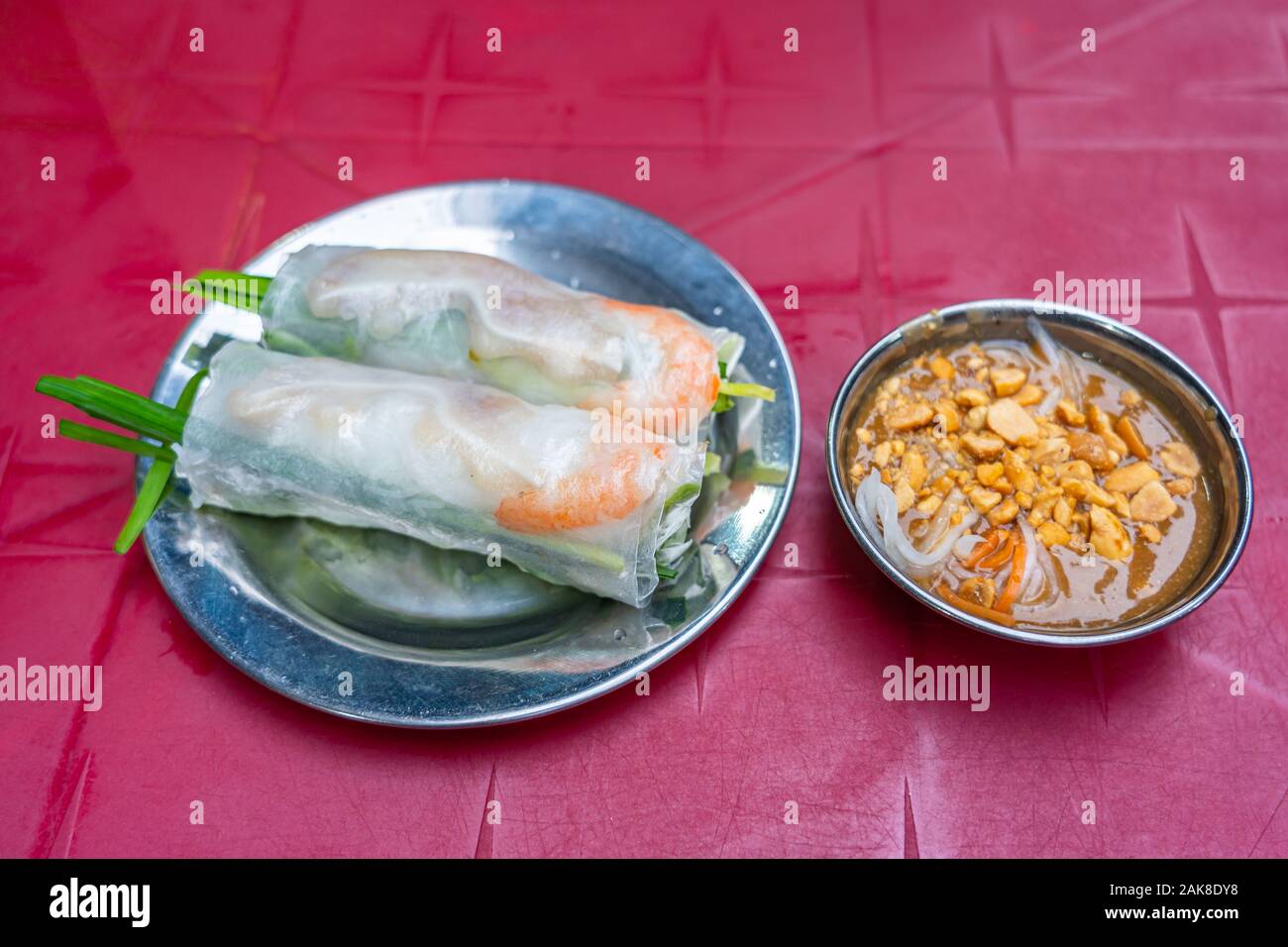 Vietnamese cuisine- rice paper spring roll served with peanut sauce ...