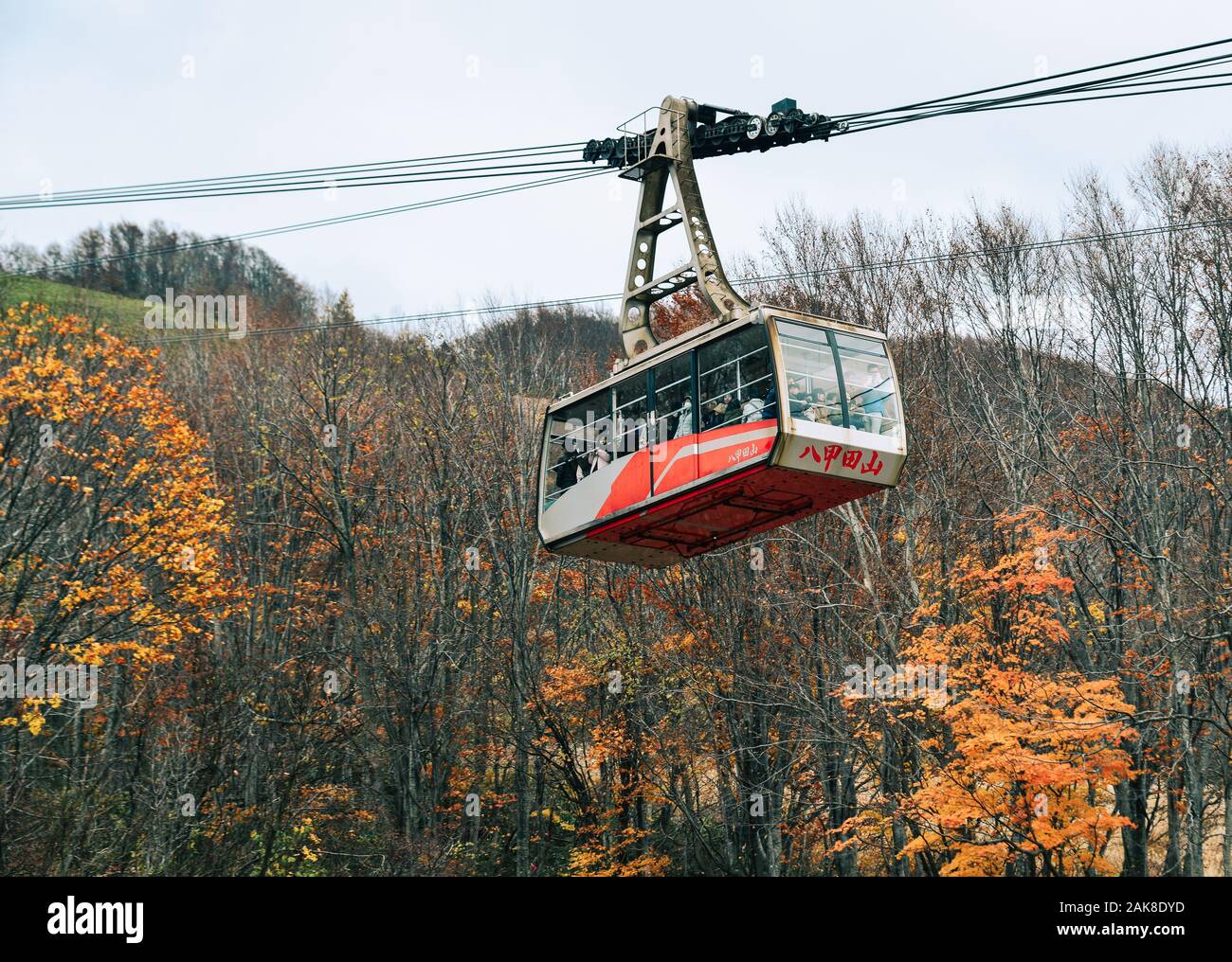 Aomori, Japan - Nov 4, 2019. Hakkoda Ropeway with autumn trees in sunny ...