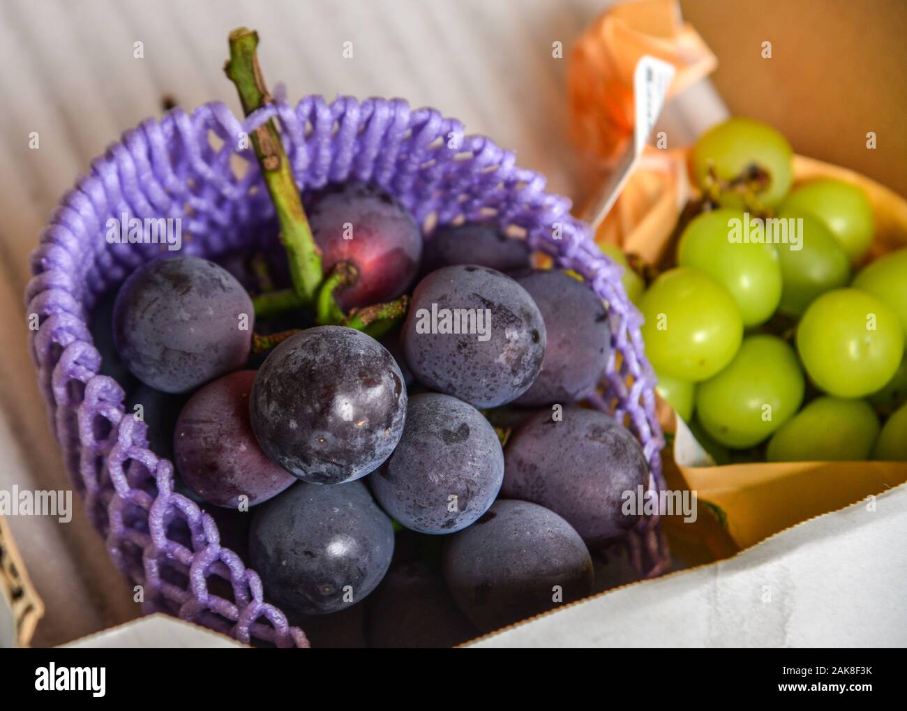 Close-up of Kyoho grapes (giant mountain grapes) at supermarket in ...