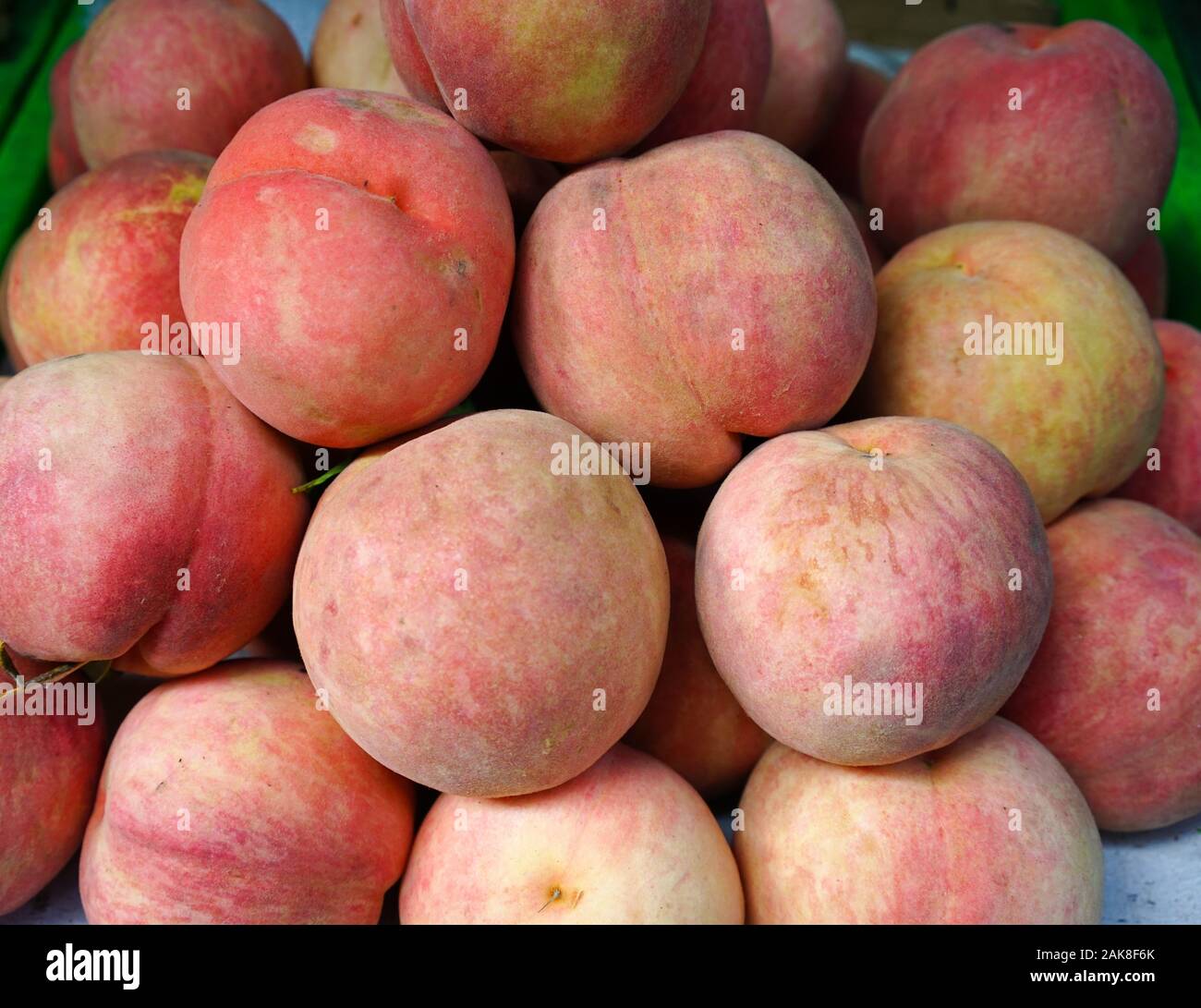 Sweet red ripe peaches at the rural market in Chengdu, Sichuan Province ...