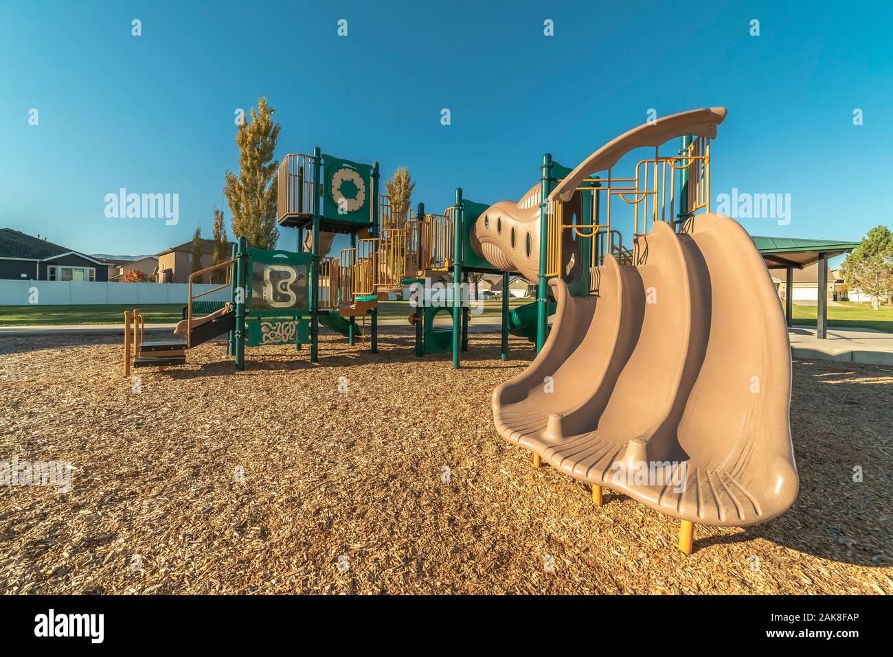 Unusual triple slide in a kids playground Stock Photo - Alamy