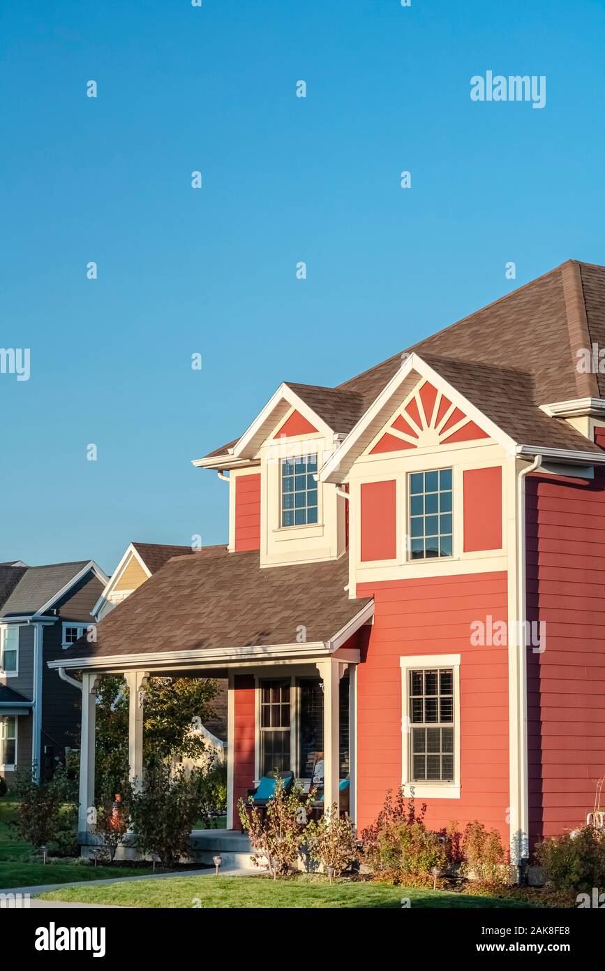 Colourful red timber suburban house near sunrise Stock Photo - Alamy