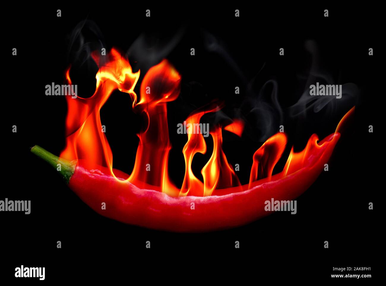 Red Hot chili pepper on fire and smoke at black background Stock Photo ...