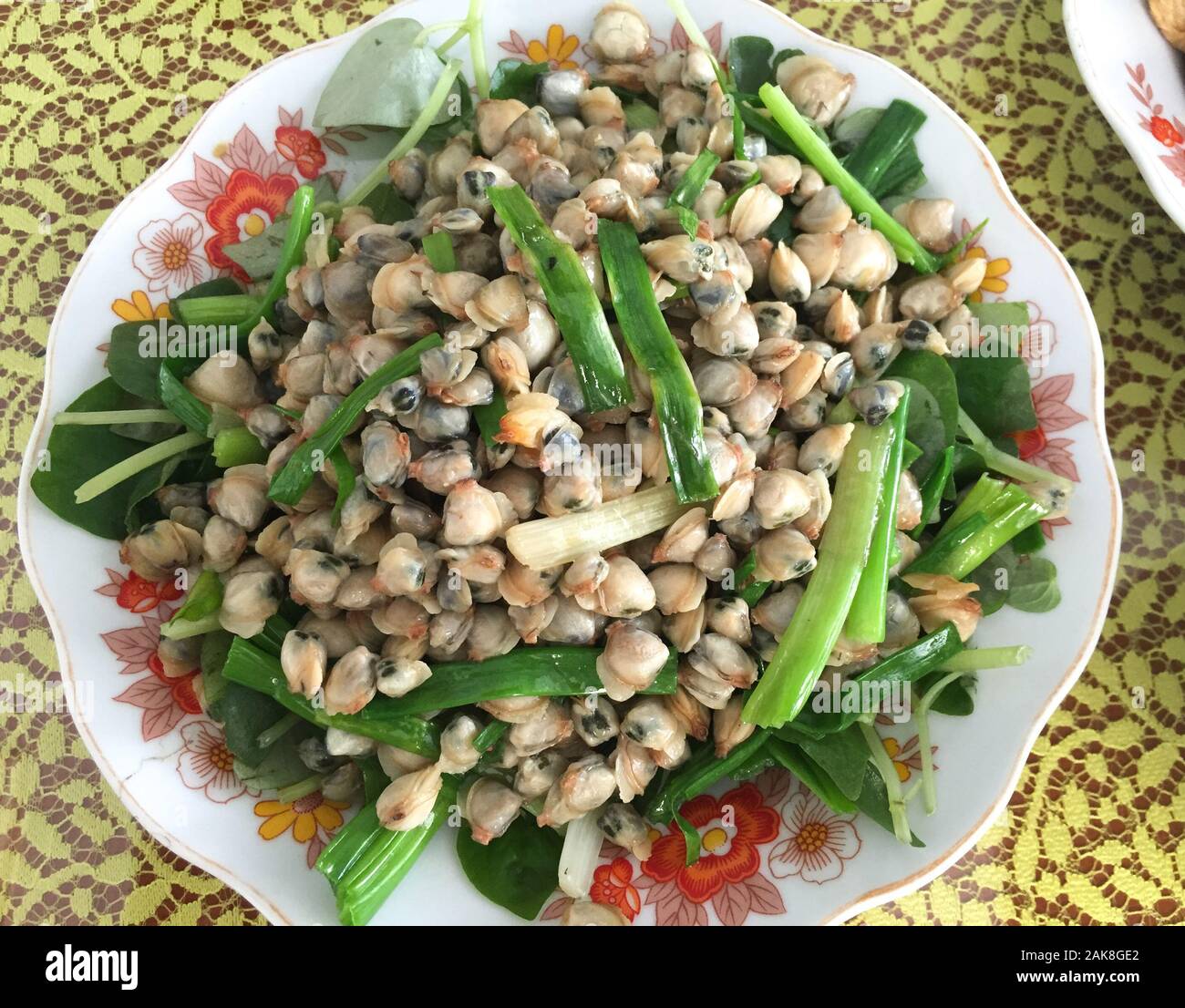Fried clam with green onion for lunch at local restaurant in Mekong ...