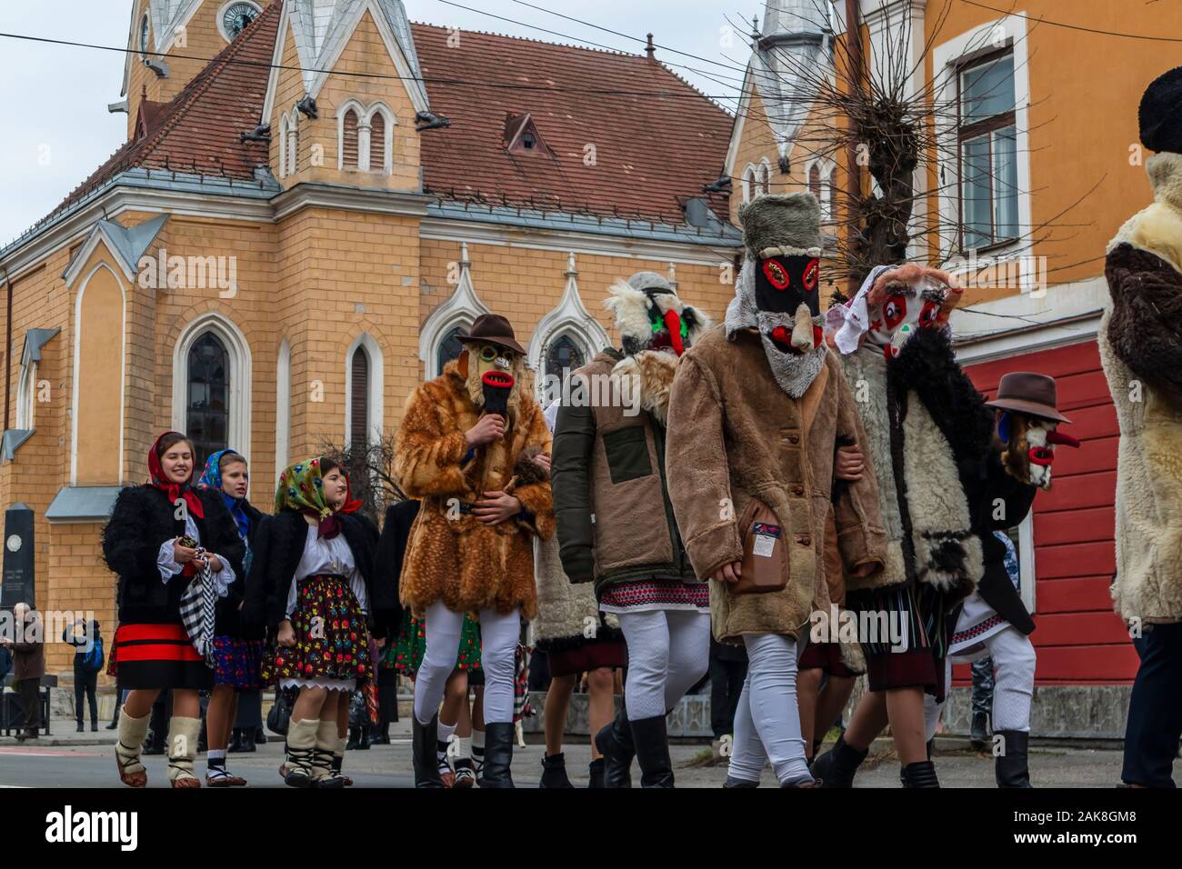 Christmas carols and games with masks. Big carnival parade, hundreds of ...