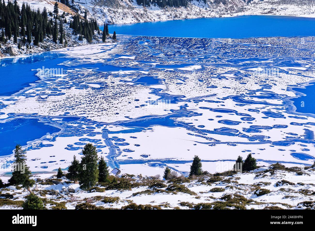 Bizarre forms of ice on a frozen mountain lake, guessing the shape of a ...