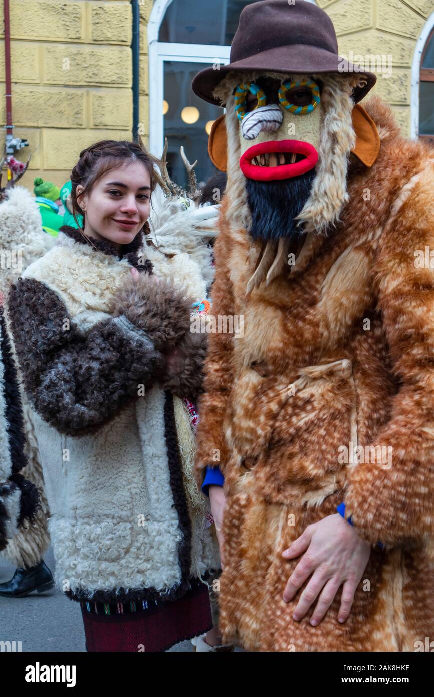 Christmas carols and games with masks. Big carnival parade, hundreds of ...