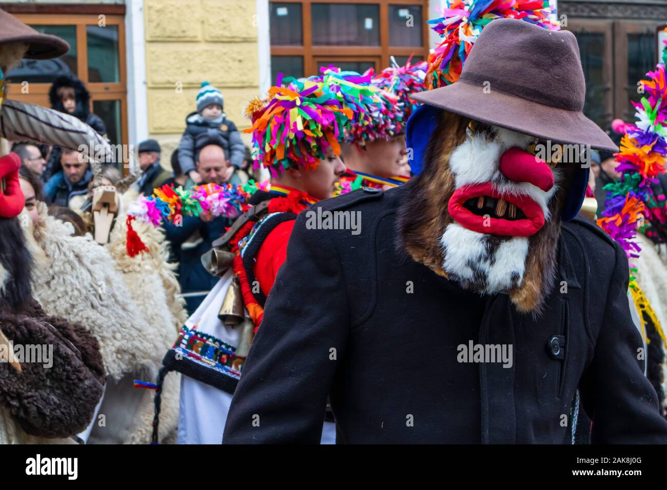 Christmas carols and games with masks. Big carnival parade, hundreds of ...