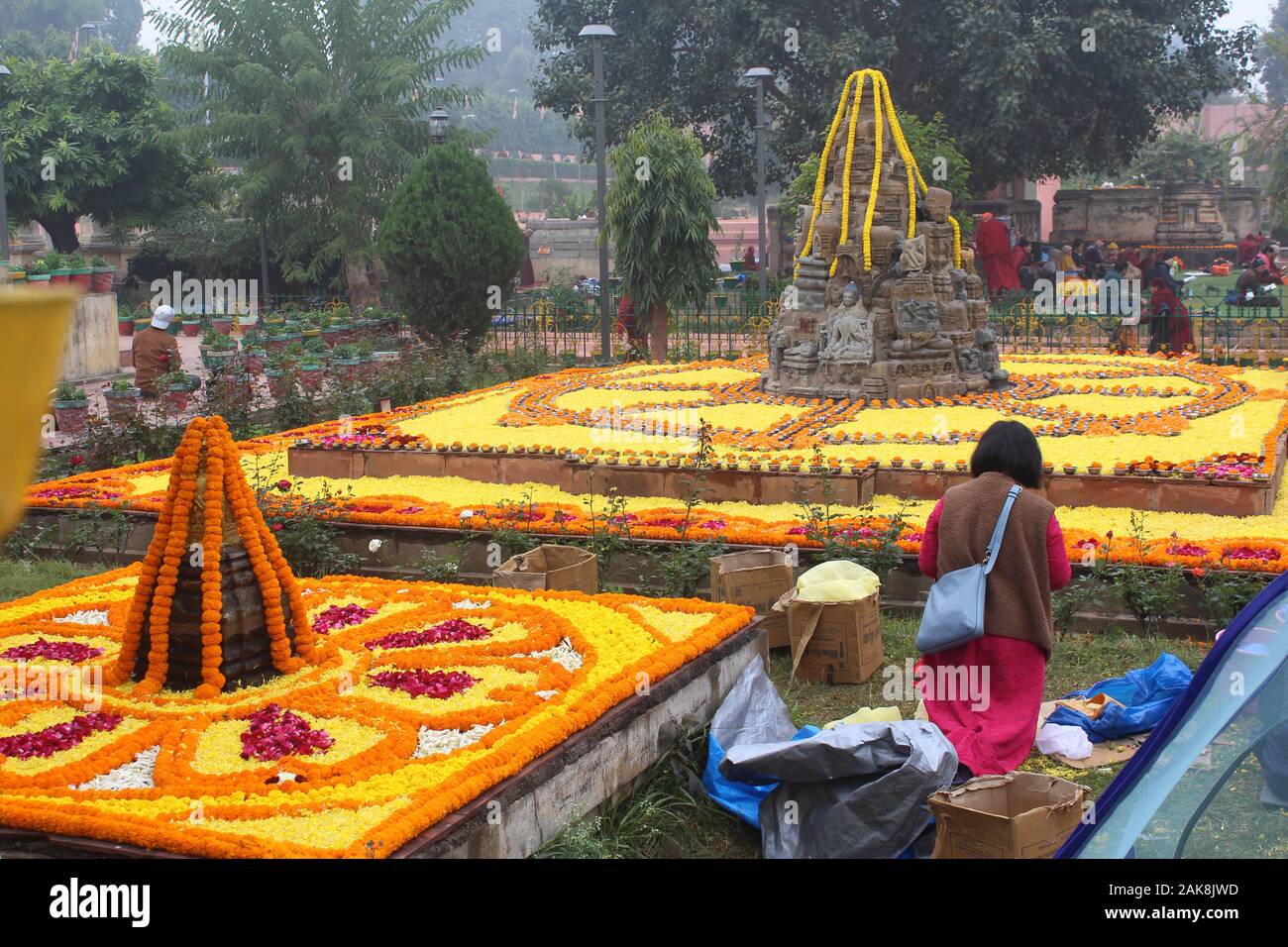 Flowers offering to Buddha Stock Photo - Alamy