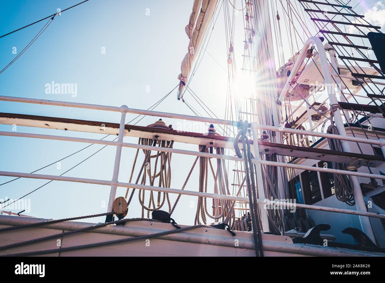 Sailboat docked in port with a beautiful sunset Stock Photo - Alamy