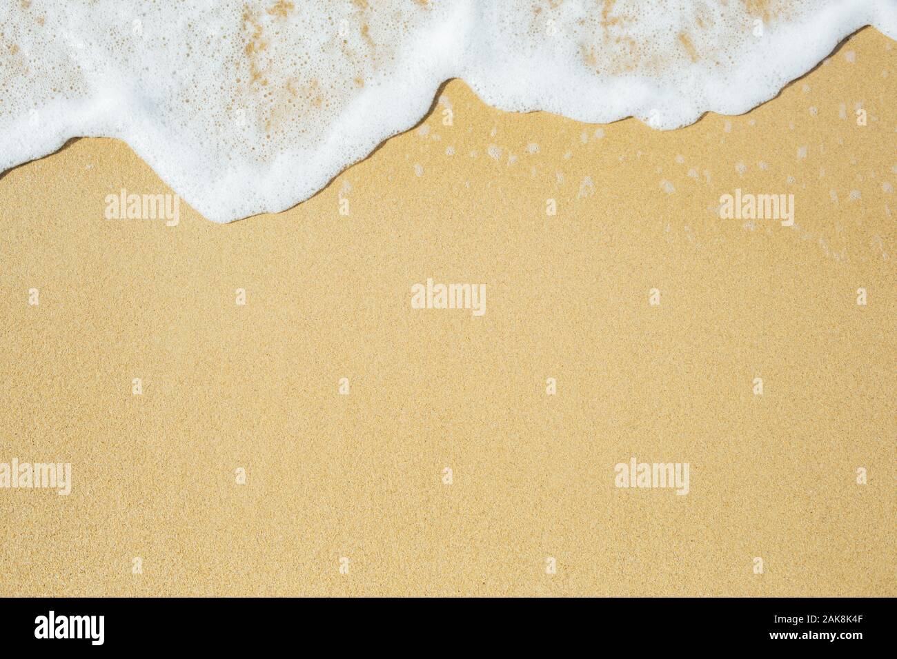 Soft wave of sea foam on sandy beach. Background, texture Stock Photo ...