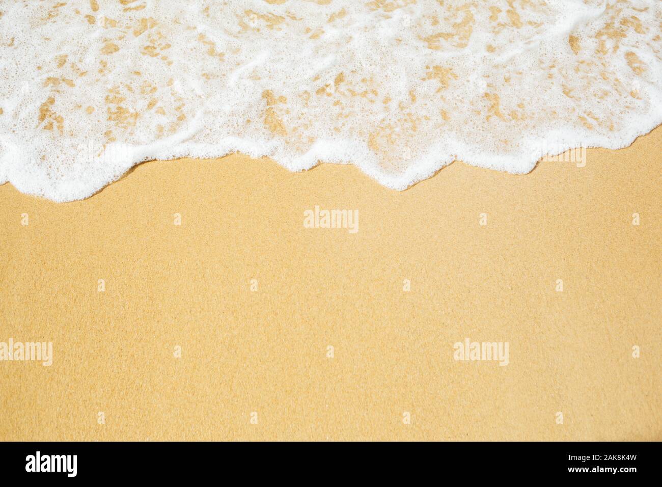 Soft wave of sea foam on sandy beach. Background, texture Stock Photo ...