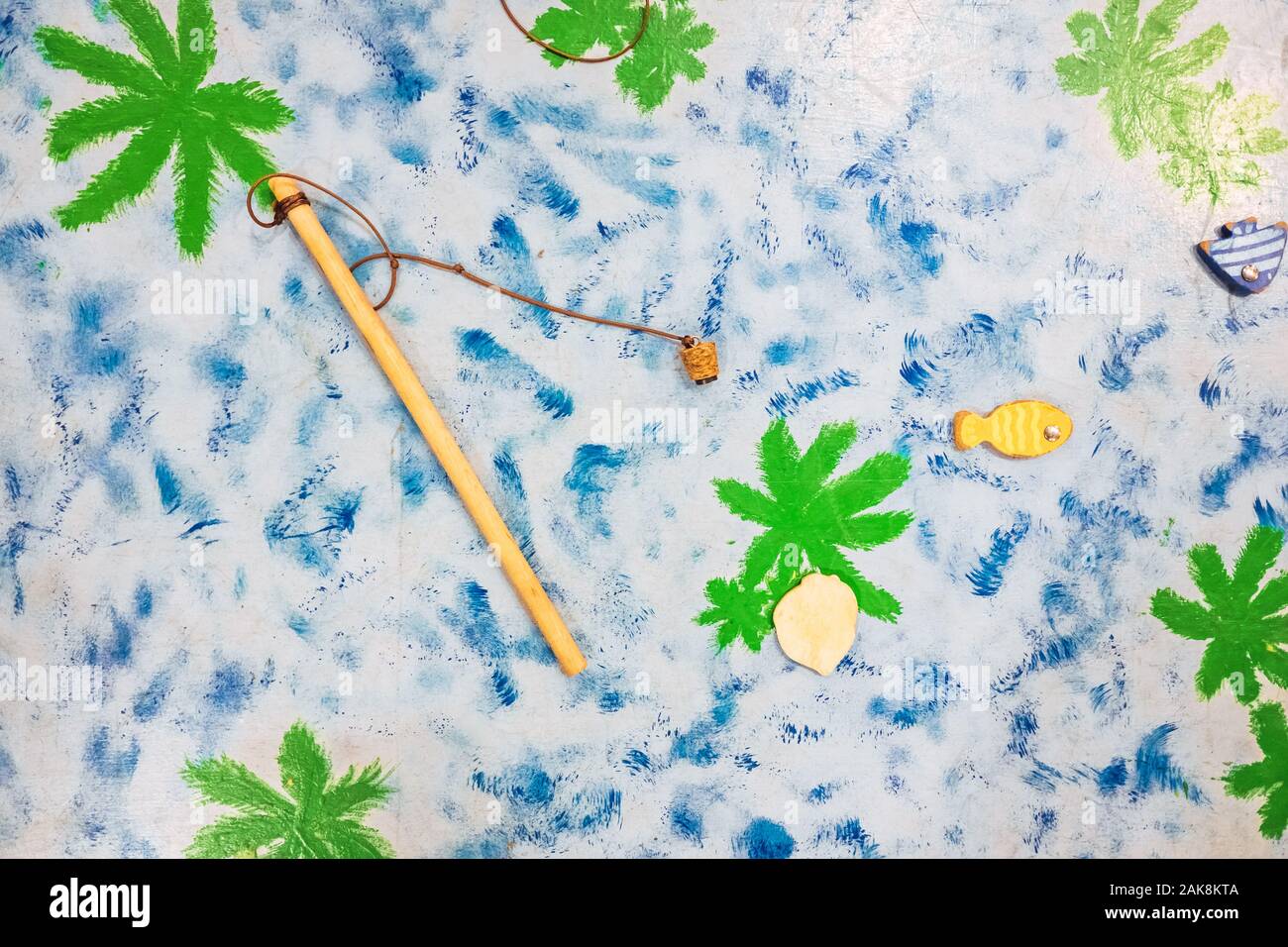 Children's fishing game with a stick Stock Photo - Alamy