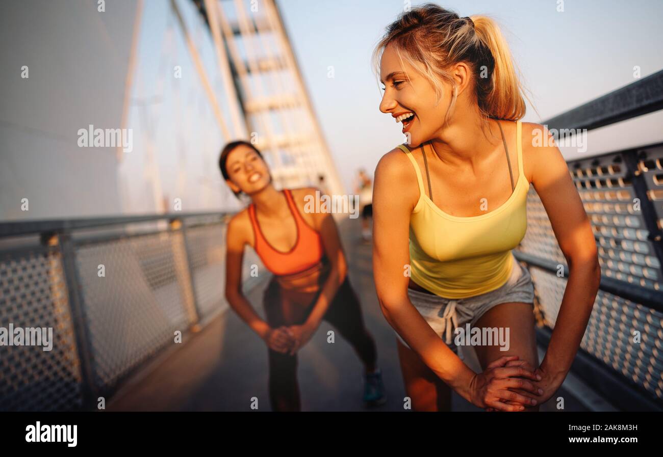 Fitness, sport, people, exercising and healthy lifestyle concept. Happy ...