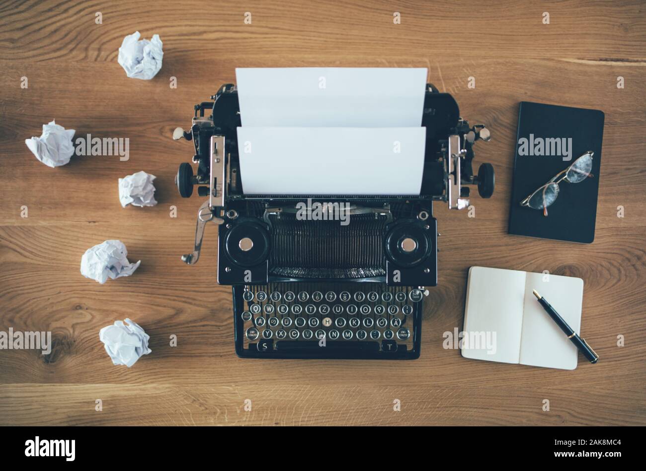 Vintage writer's desk with typewriter with crumpled papers Stock Photo ...
