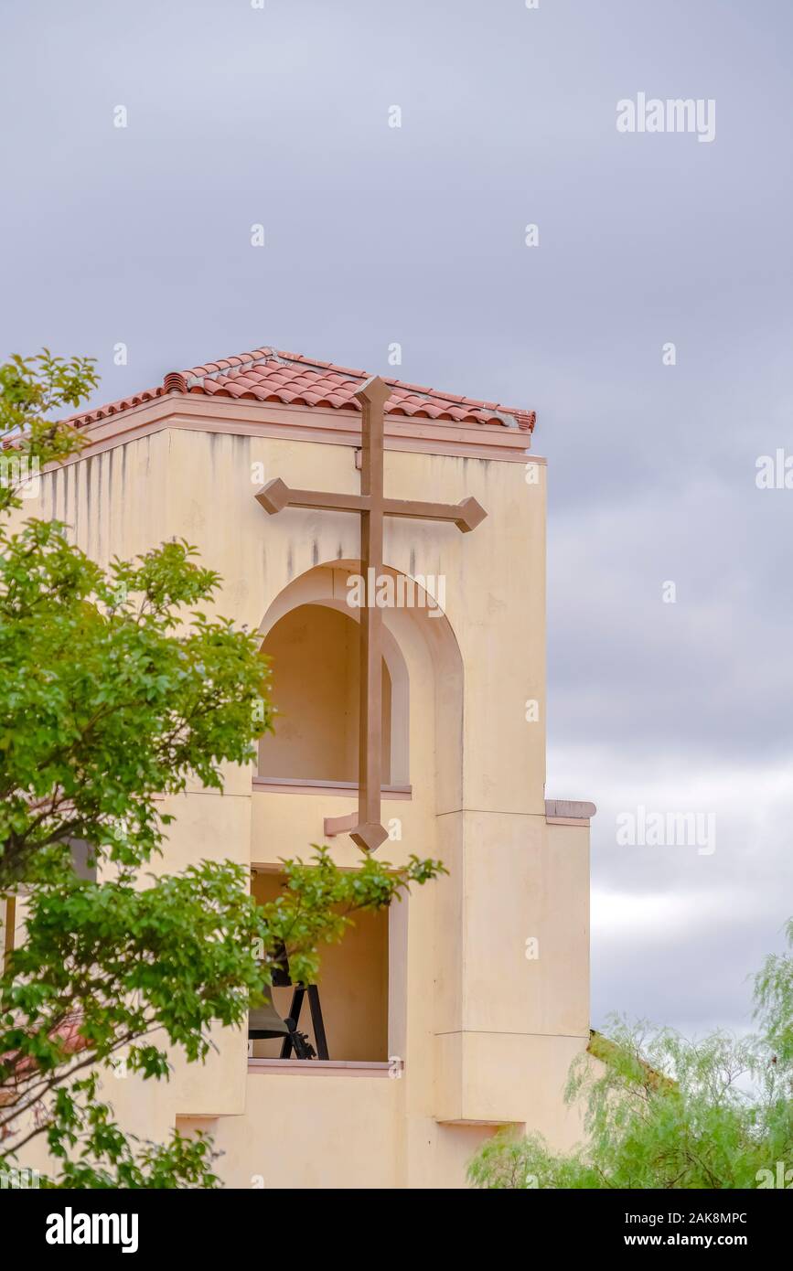 Simple cross on the bell tower of a small church Stock Photo - Alamy