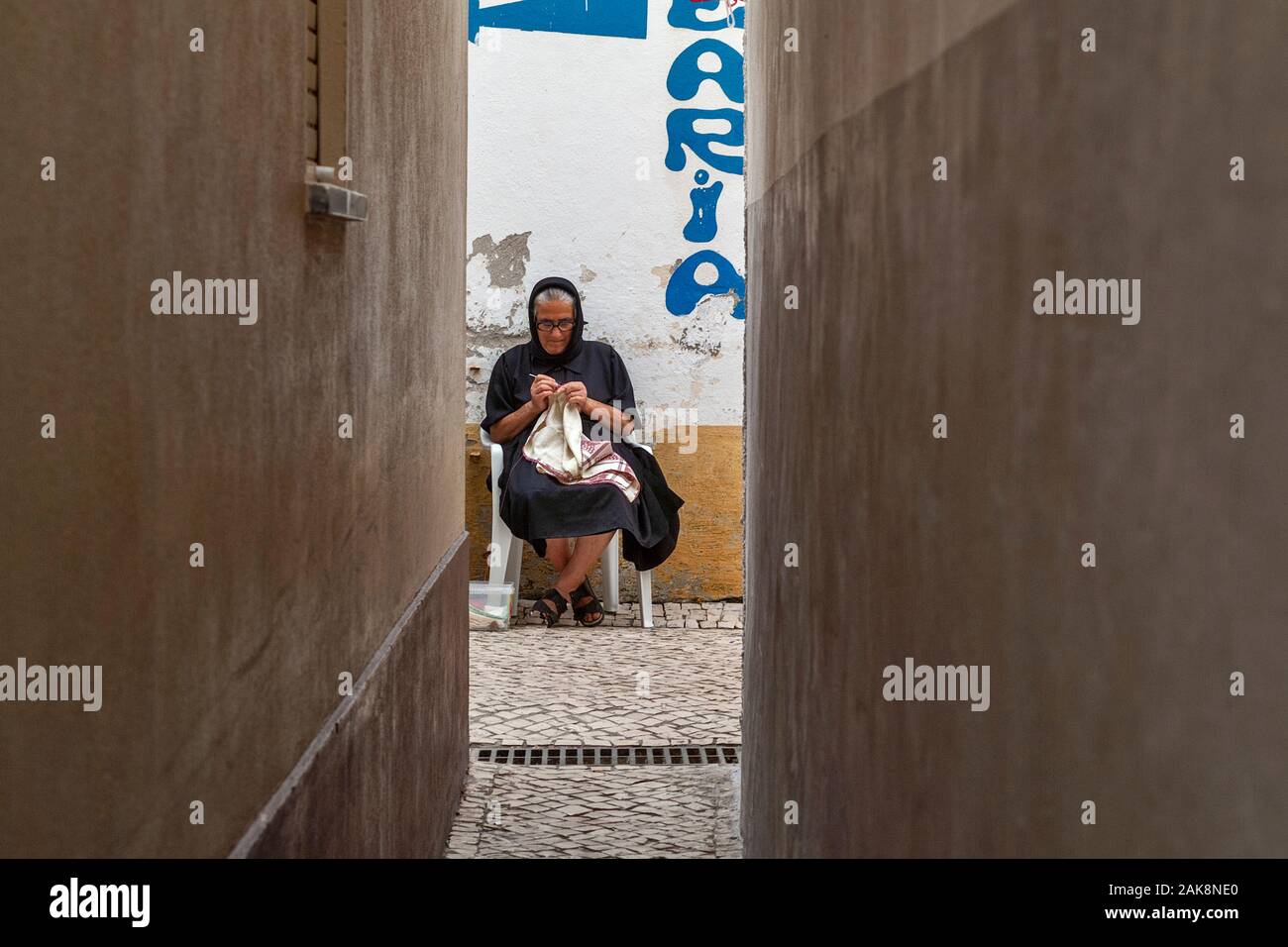 old women in typical black clothes in Nazare, Portugal Stock Photo - Alamy
