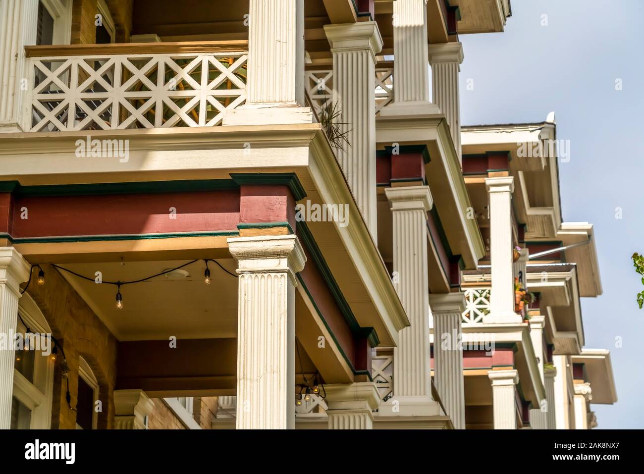 Close up of square columns and lattice railing framing the balcony of ...