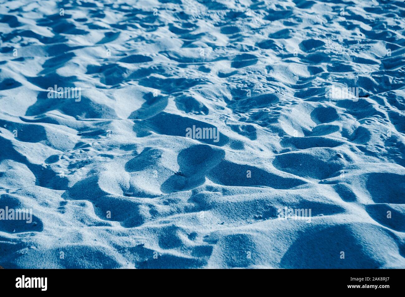 Textured sandy background. 2020 color trend of classic blue Stock Photo ...
