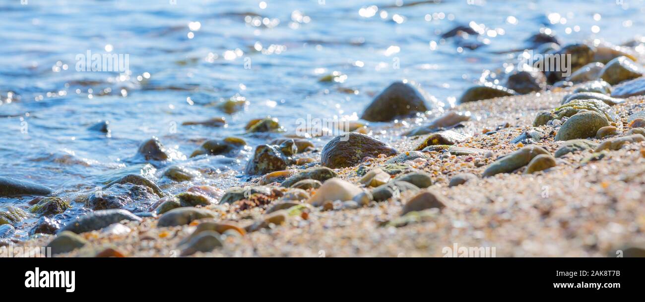 Sea stones background, ocean water edge at the beach coast Stock Photo ...