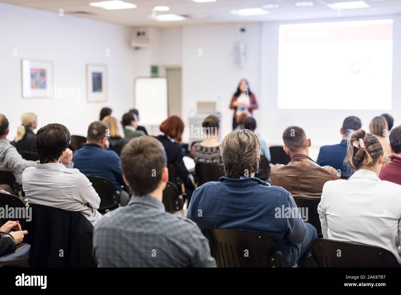 Woman giving presentation on business conference workshop Stock Photo ...