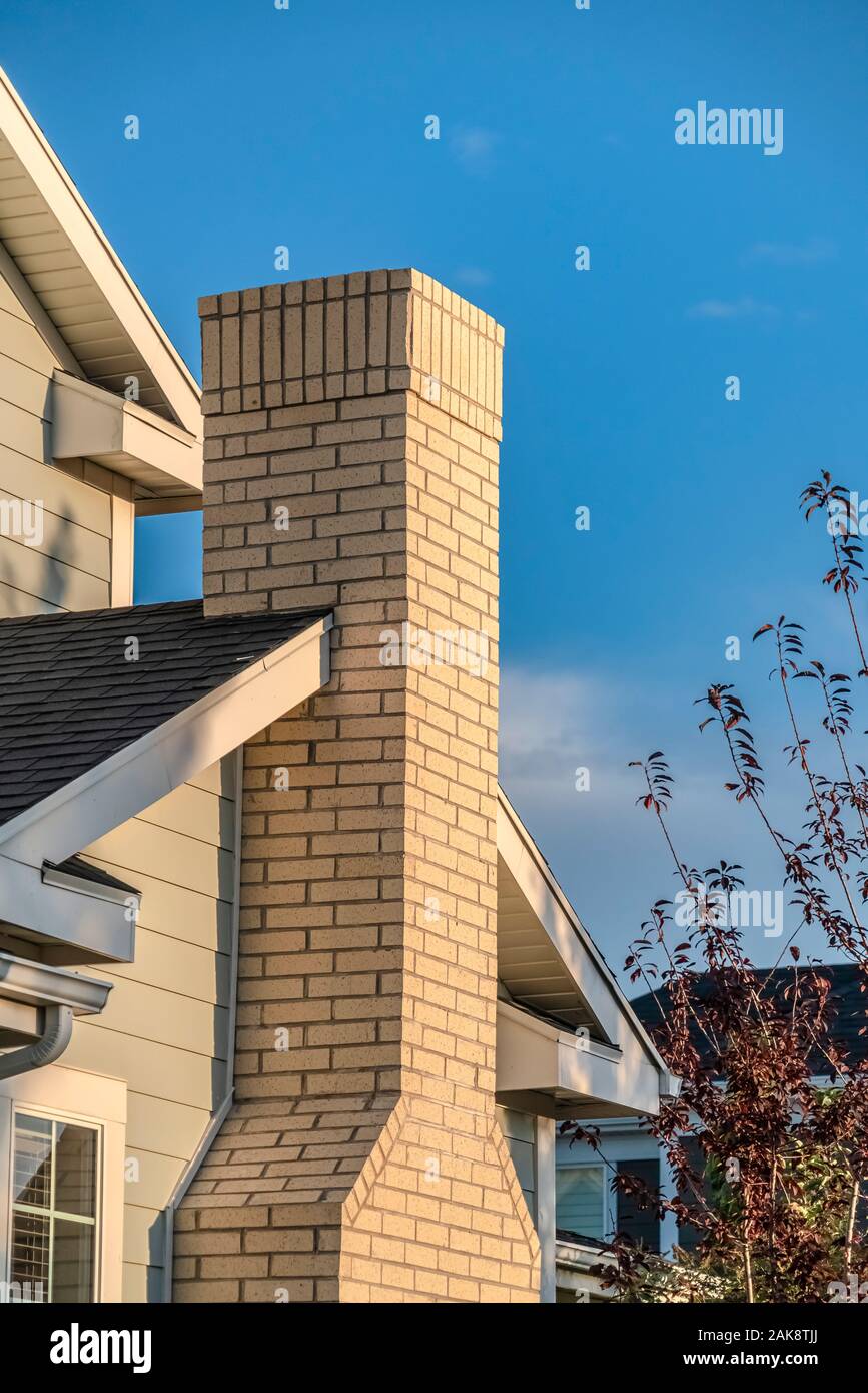 Feature brick chimney on a house exterior Stock Photo - Alamy