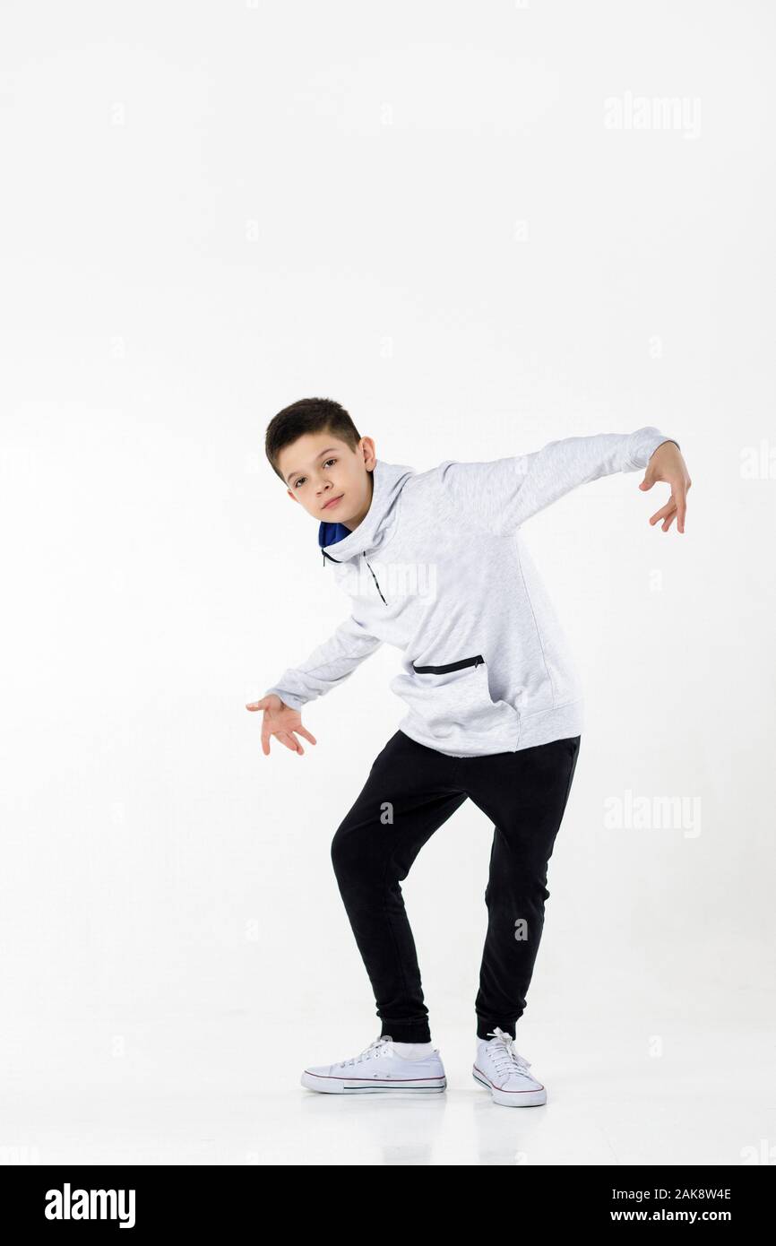 Little hip-hop boy dancing on white studio background. sports dance ...