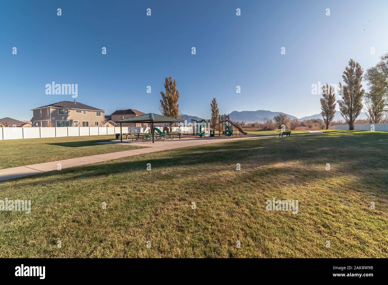 Kids playground and picnic area in an urban park Stock Photo - Alamy